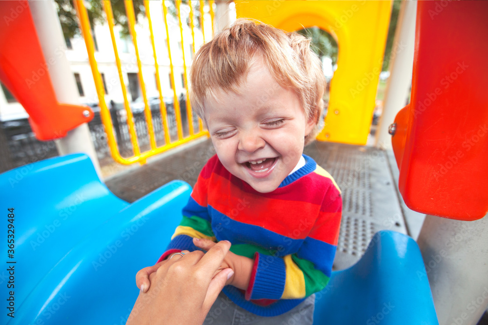 The child laughs from the tickle. Tickling the boy. Happy moments of ...