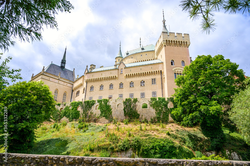 View of neogothic Bojnice castle with small fortification wall from ...
