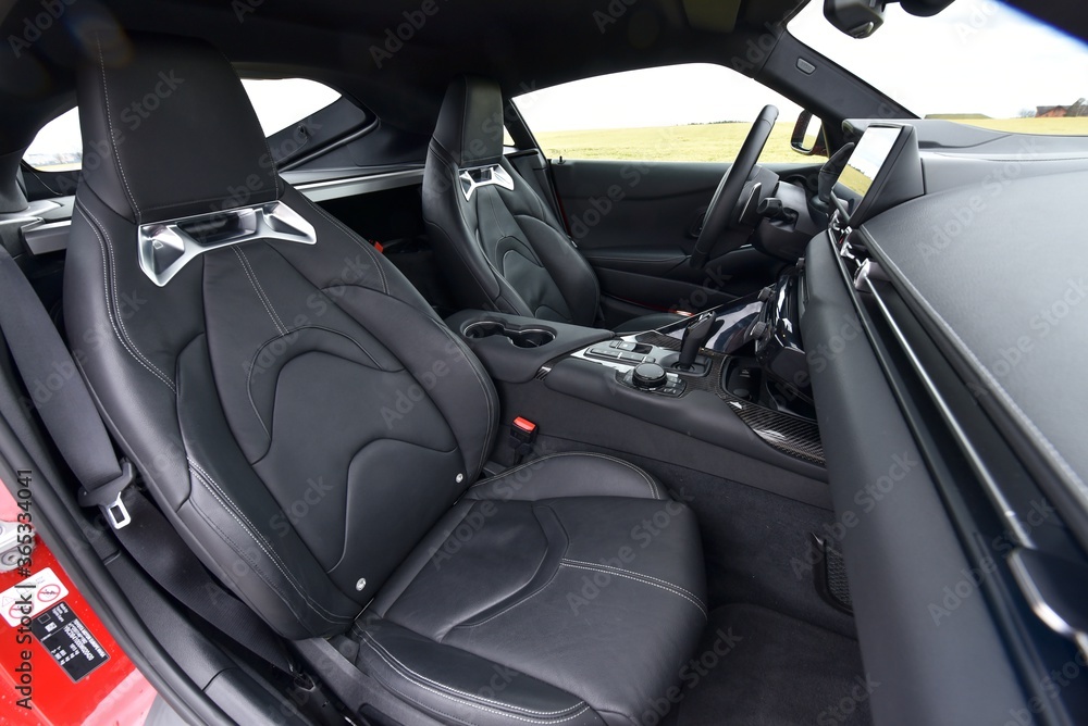 Toyota Supra. Sports car on a country road. Cockpit - seats and ...