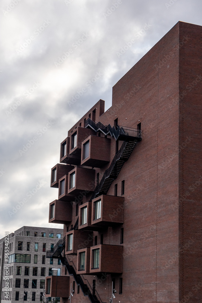 Vertical red bricks modern building with original windows architecture ...