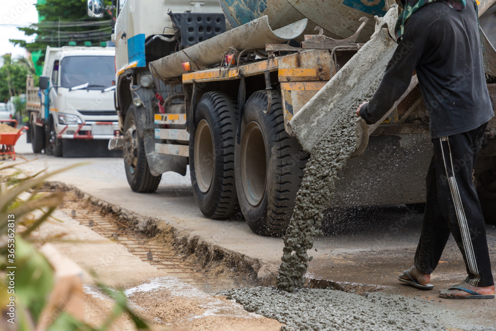 Mixed concrete pouring at construction site. Pouring cement during ...