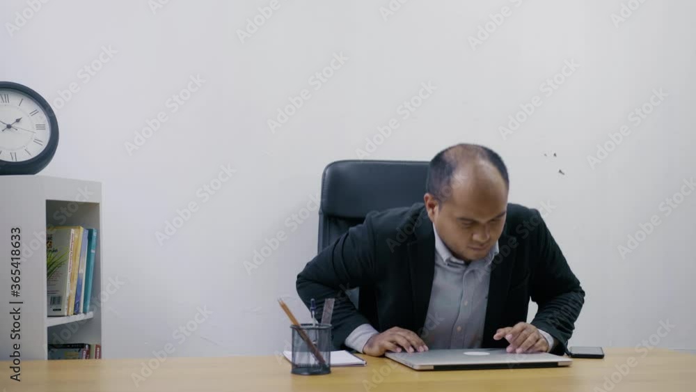 Video Stock Office Syndrome. A Business man wearing a suit turn off his ...