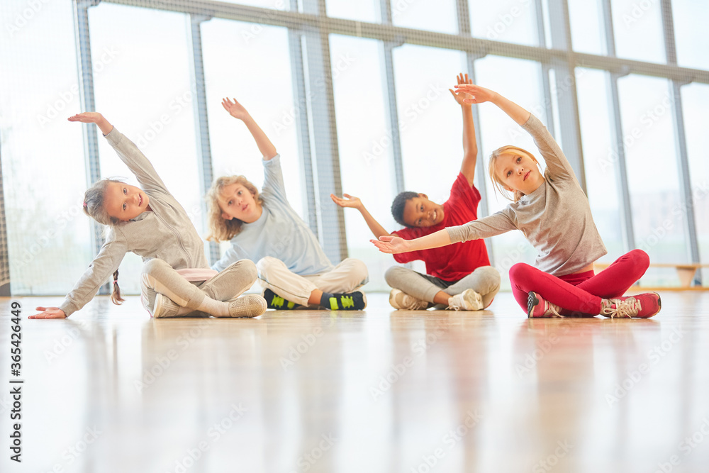 Pupils group in healthy stretching Stock Photo | Adobe Stock