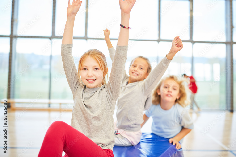 Group of kids at a gym exercise Stock Photo | Adobe Stock
