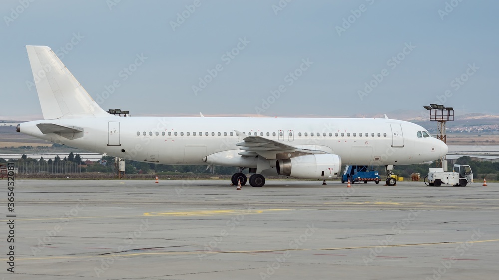 Side view of airplane. White commercial passenger jet airliner on ...