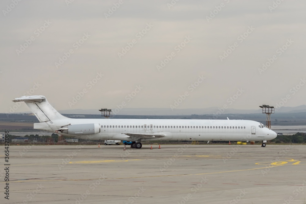 Side view of airplane. White commercial passenger jet airliner on ...
