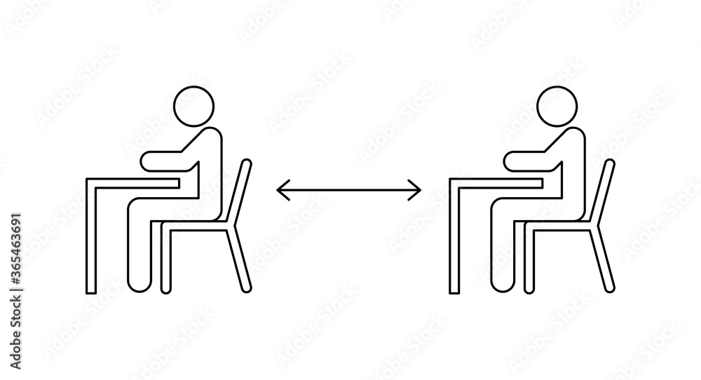 Keep safe distance at school concept. Two students sitting at tables ...