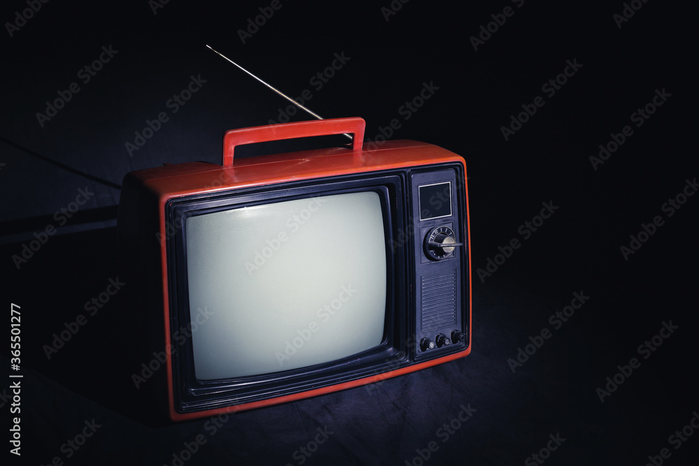 Retro red old TV with antenna in dark room, vintage television on black ...