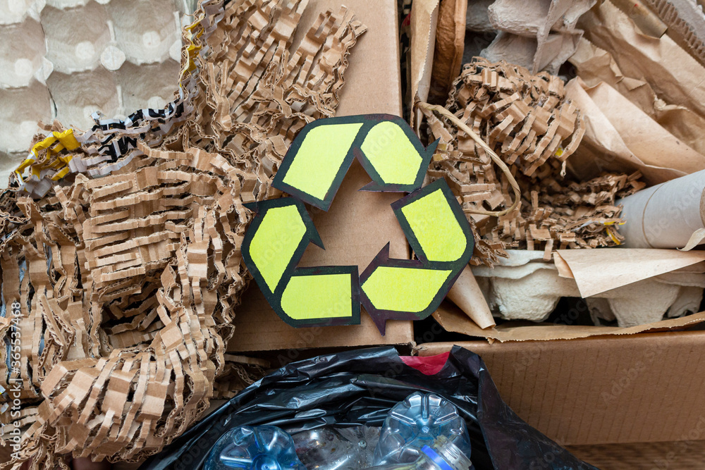 Paper, cardboard, cartoon used waste with a recycling sign Stock Photo ...