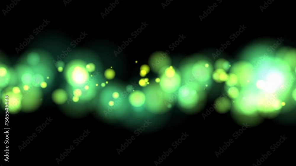 Green and yellow orbs of various shades form a horizontal line in the ...