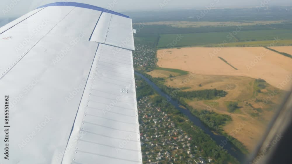 View from the window of a small passenger private plane against the ...