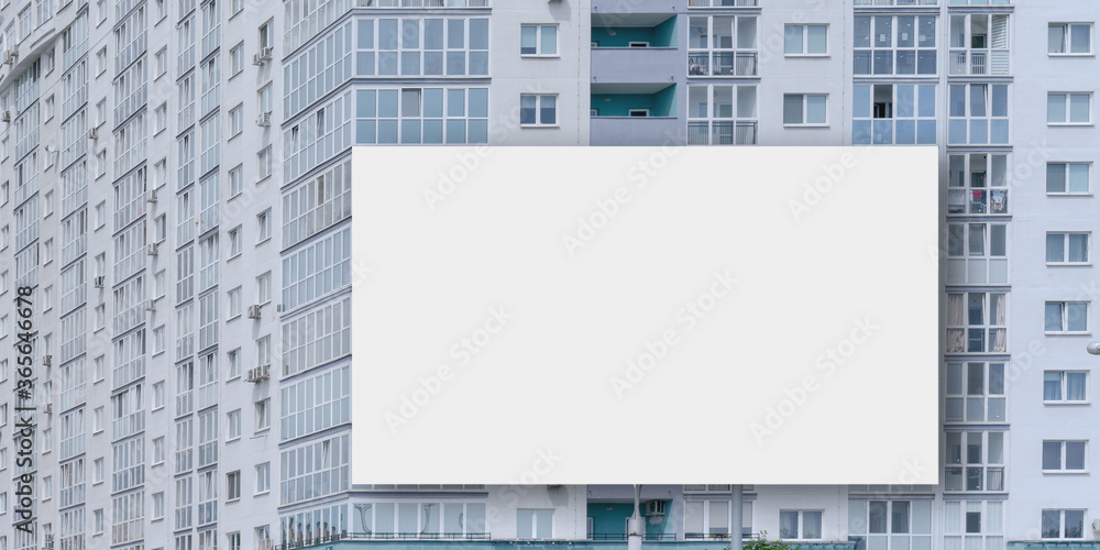 big white blank banner hanging on facade of residential building rental ...