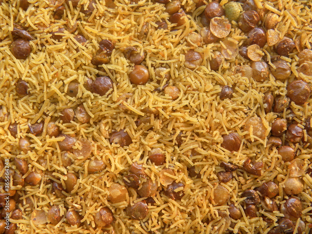 Yellow and brown color deep fried Dalmoth sev spicy Indian snack made ...