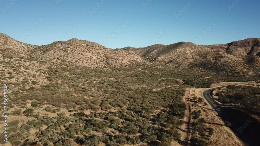 4K aerial drone video of Africa savanna hills, mansions and houses up n ...