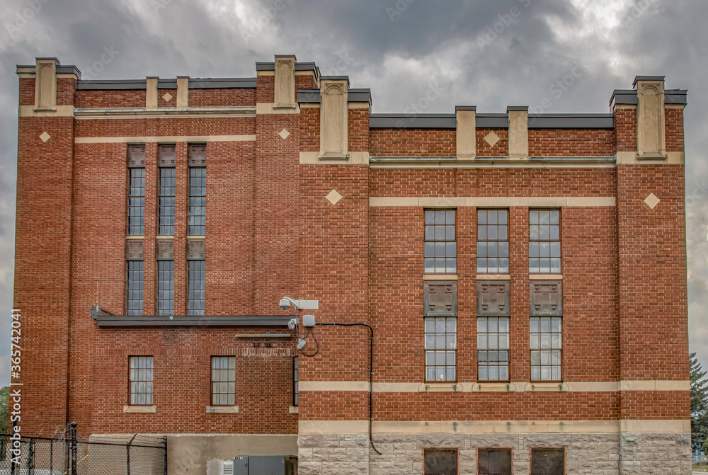 Art Deco electrical substation exterior red brick wall, metal window ...
