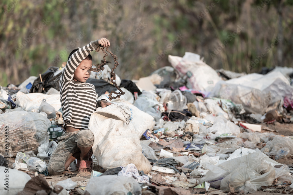 Child labor. Children are forced to work on rubbish. Poor children ...