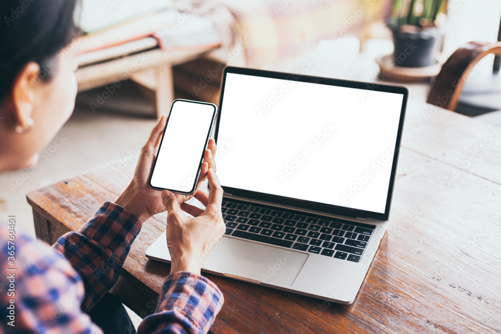computer,cell phone mockup image.hand woman work using laptop texting ...