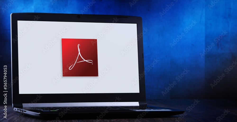 Laptop computer displaying logo of Adobe Acrobat Stock Photo | Adobe Stock