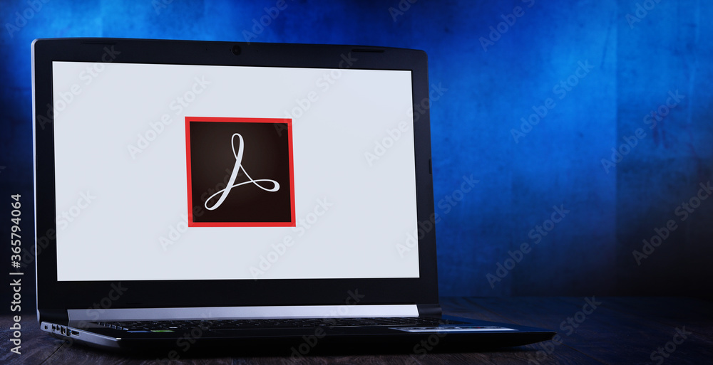Laptop computer displaying logo of Adobe Acrobat Stock Photo | Adobe Stock