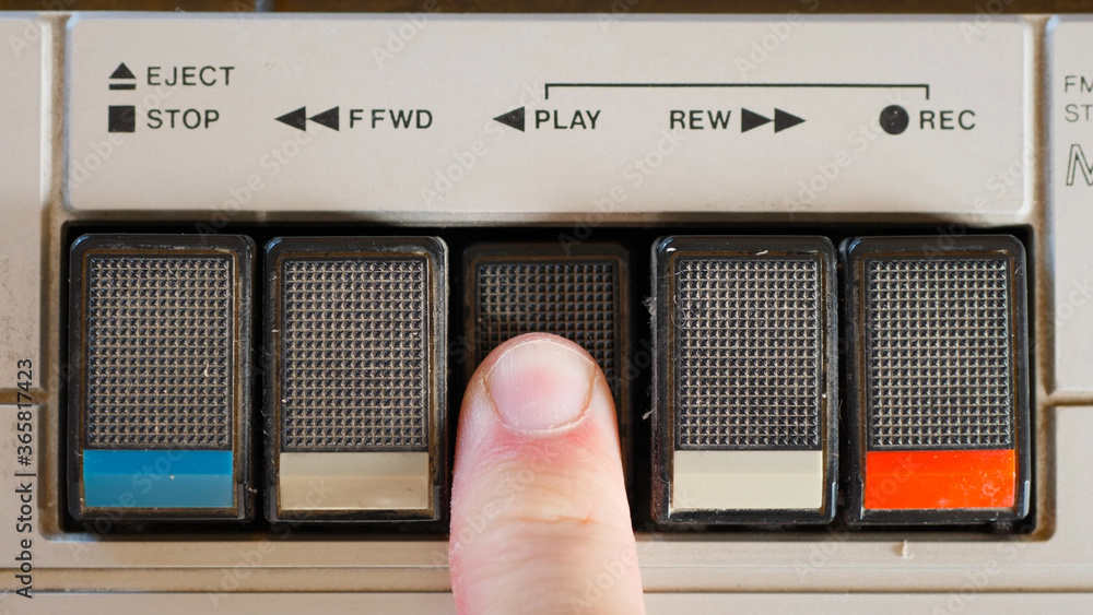 Pressing Play Button on a Retro Cassette Player Stock Photo | Adobe Stock
