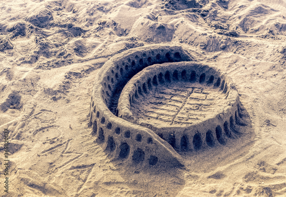 Roman Colosseum sand sculpture at Playa den Bossa beach at Ibiza, Spain ...