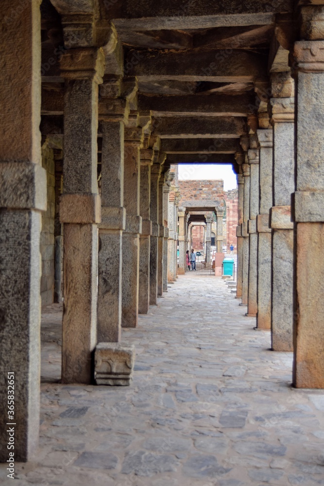 Inside the Qutub Minar Complex with antic ruins and inner square ...