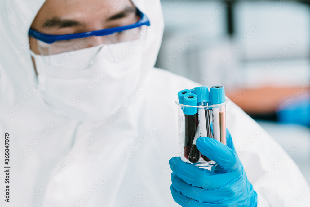 Lab Technician in Personal protective equipment PPE suit Vaccines ...