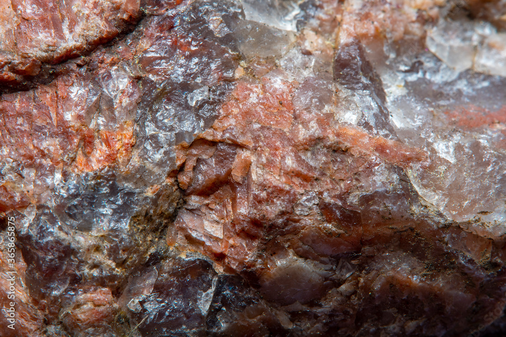 Photograph of a granite surface interspersed with transparent mica in ...