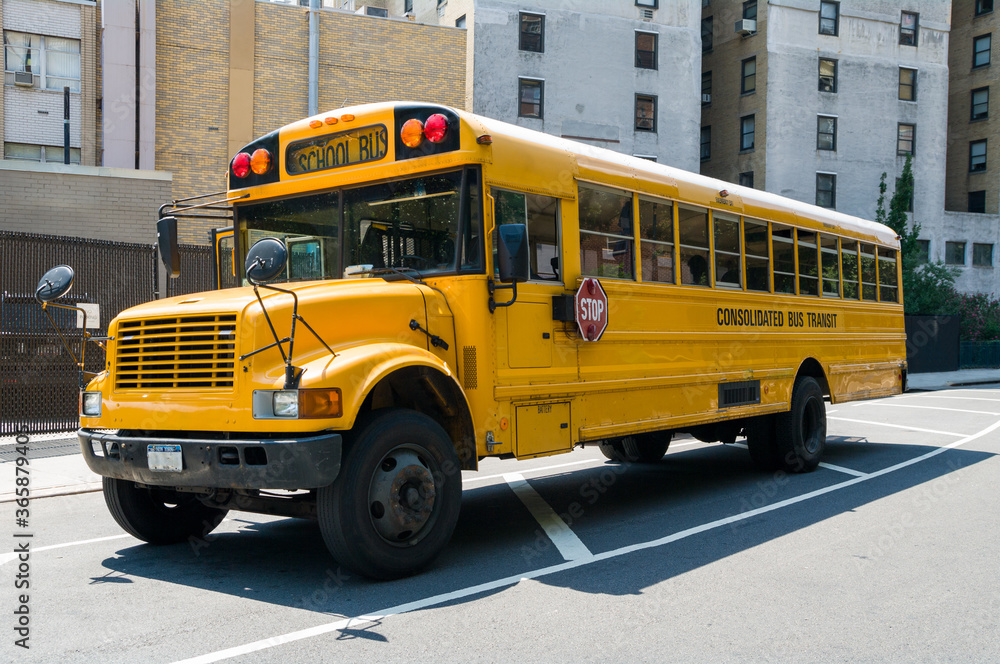 Isolated yellow USA american school bus on street in city Stock Photo ...