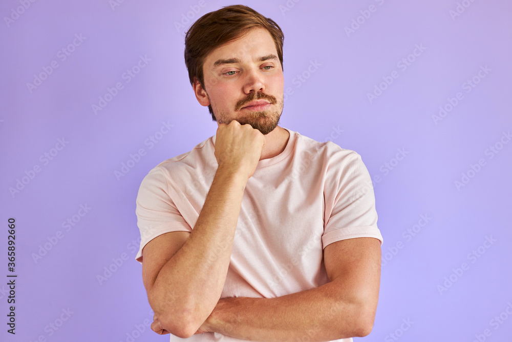sad man thinks about meaning of life, caucasian bearded guy looks down ...