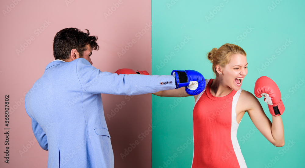 Boxers fighting in gloves. Gender equality. Man and woman boxing fight ...