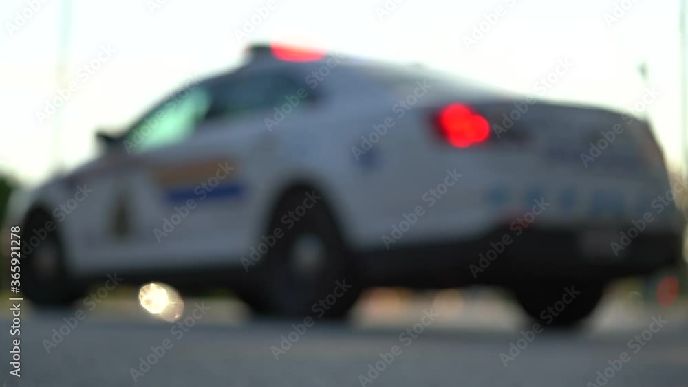Blurred out police car cruiser interceptor, with the emergency lights ...
