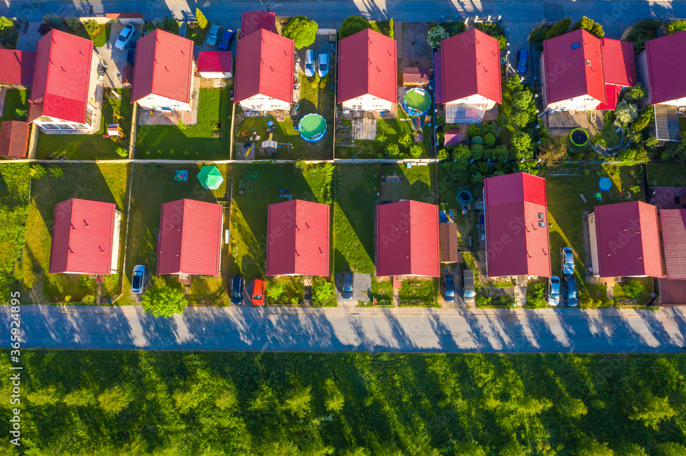 Modern one-story homes. Houses in suburb. Aerial view above of ...