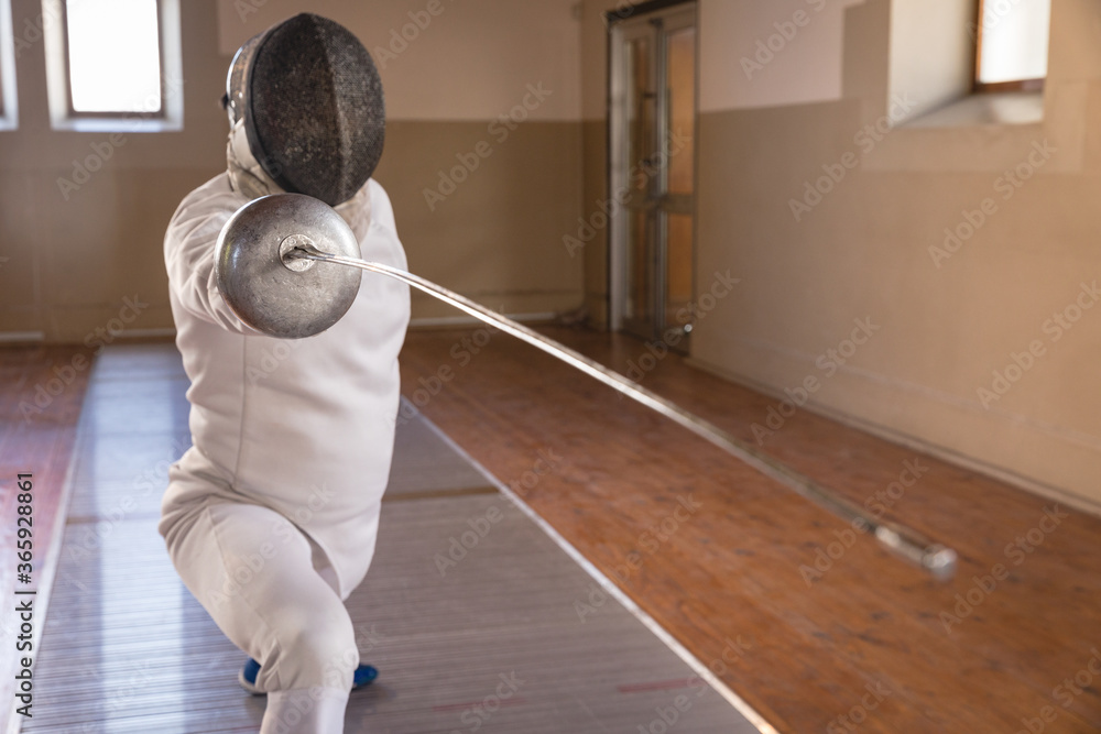 Man practicing fencing Stock Photo | Adobe Stock