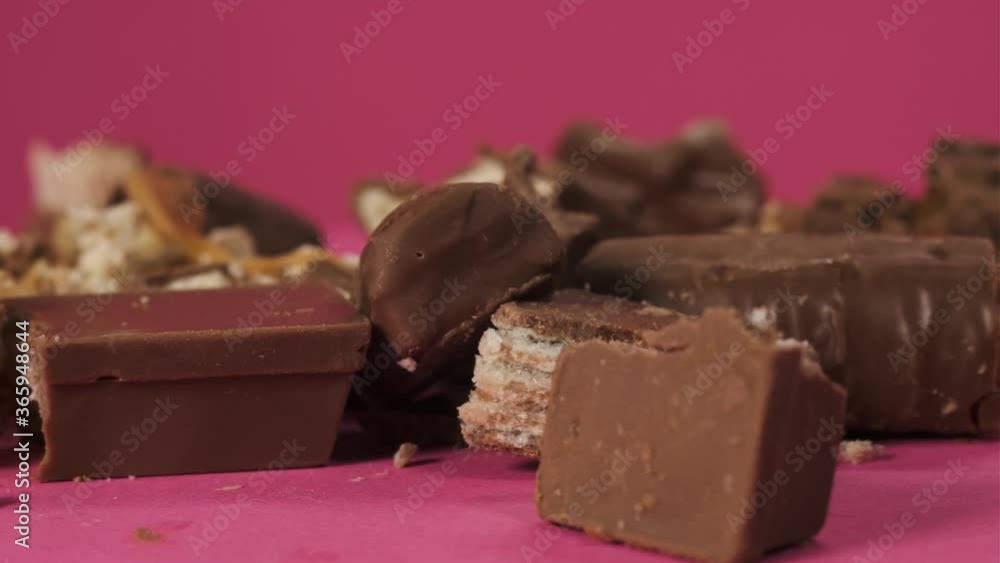 Vidéo Stock Mess with delicious and unhealthy chocolate bars smashed ...