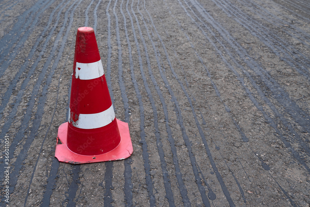 road construction or repair - laying a new layer of asphalt, marking ...