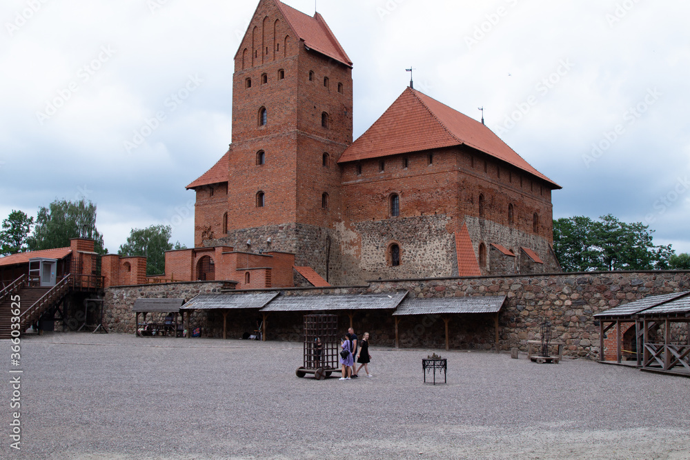 Medieval castle in Europe. Red brick castle. Walls and towers of the ...
