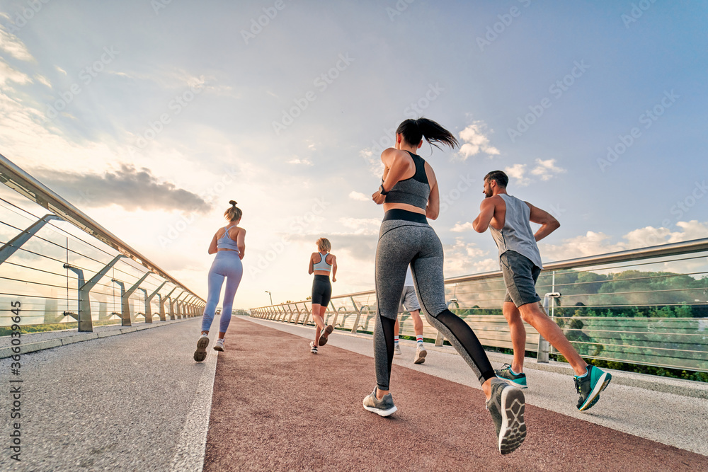 Group of people running Stock Photo | Adobe Stock