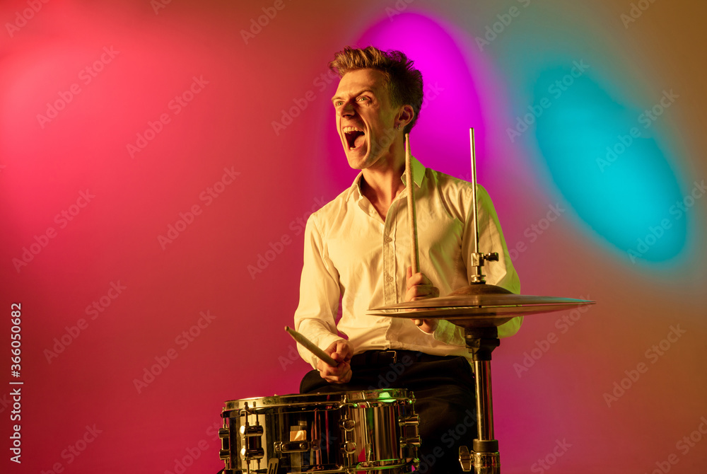 Screaming. Young caucasian inspired and expressive musician, drummer ...