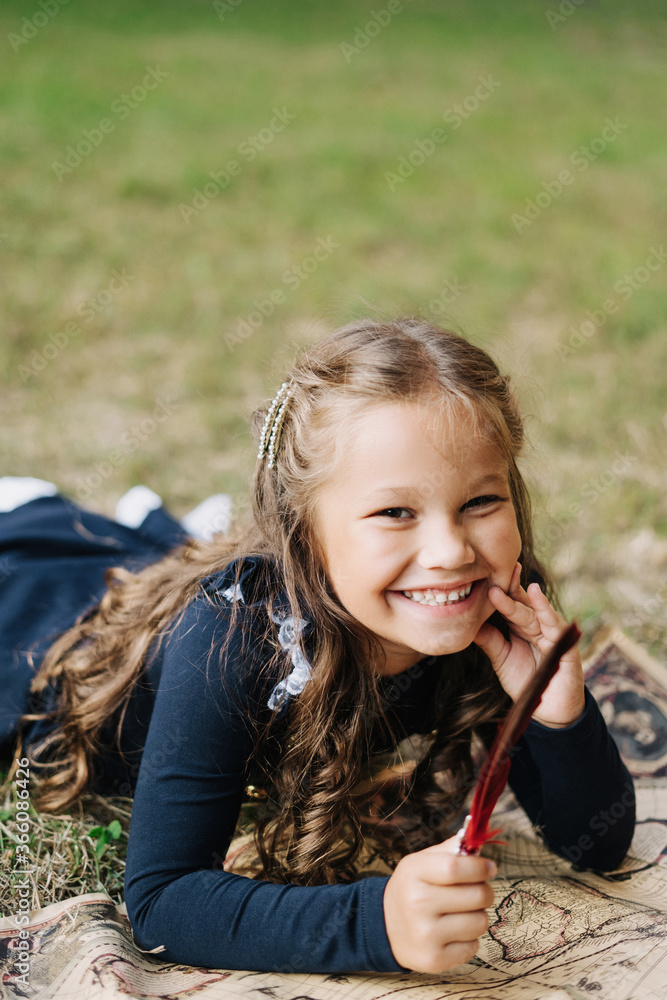 Pretty Girl Lie On Ground Hold Quill Pen World Map. Happy Caucasian ...
