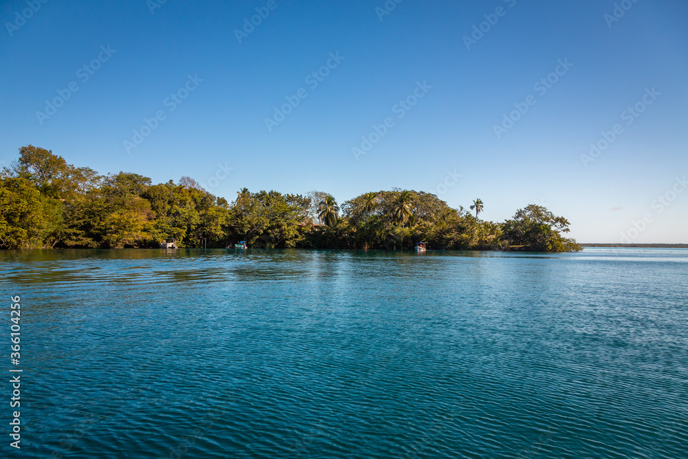 Laguna de Bacalar is also known as the Lagoon of Seven Colors, in ...