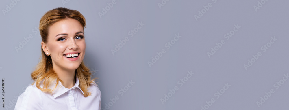 Portrait of smiling confident attractive business woman, standing over ...