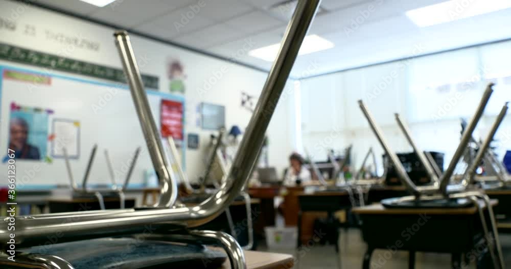 elementary school teacher works in empty classroom Stock Video | Adobe ...