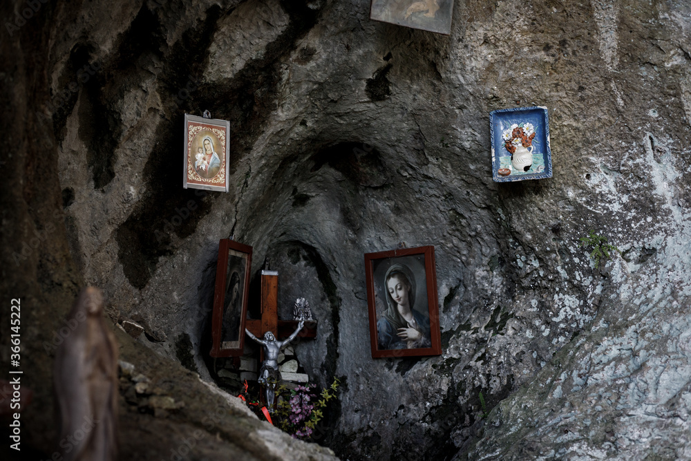 small church with pictures of saints in a bedrock cave high in the ...