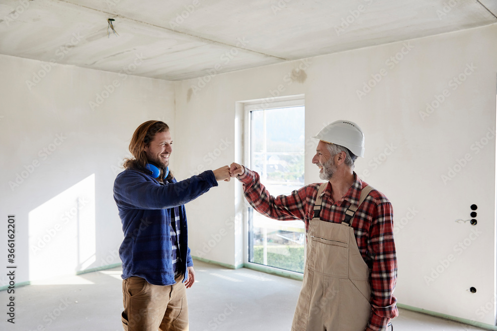 Construction worker greeting at construction site Stock Photo | Adobe Stock