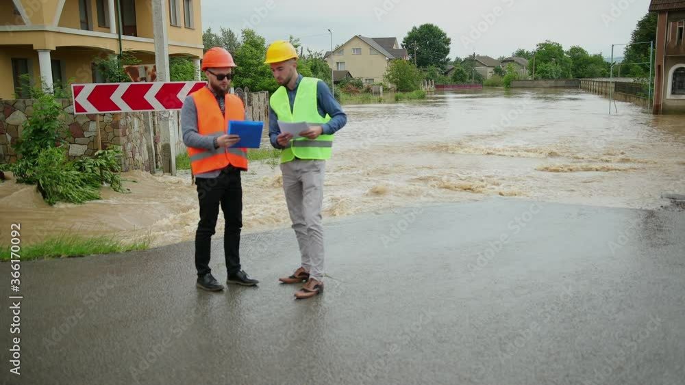 male engineers solve flood problem. Devastation wrought after massive ...