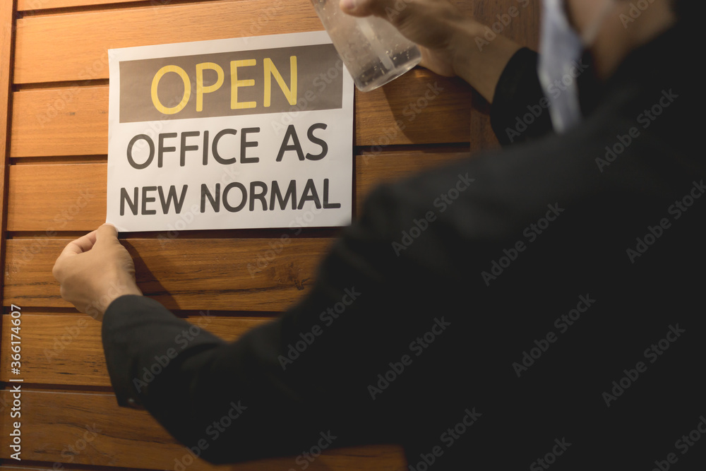 Business owner wears masks to label for open office. The concept is ...