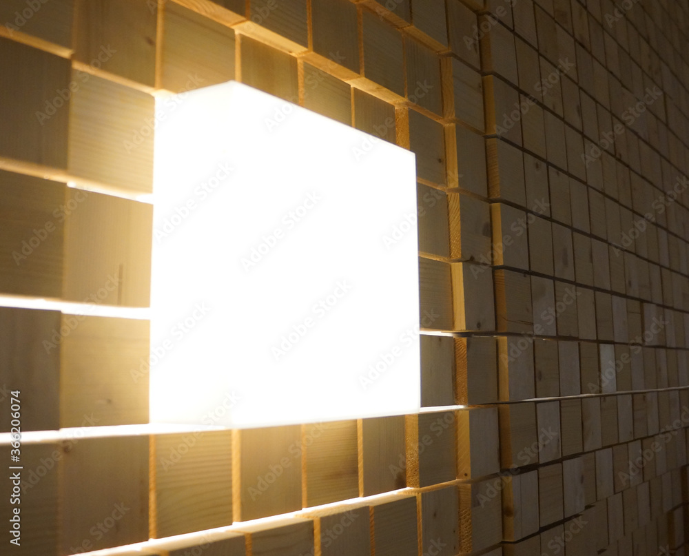 Acrylic square light box on the square wood cube are decorated on the ...