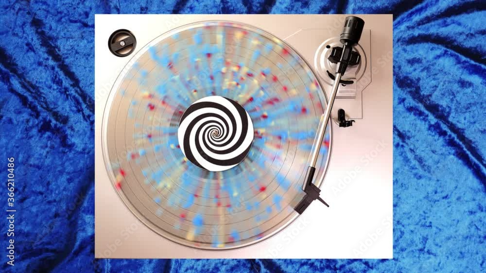 12 inch clear splatter vinyl record on a DJ turntable with blue velvet ...