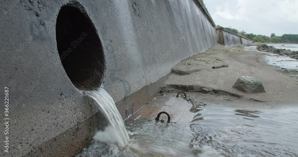 Environment pollution from sewer pipe wastewater flowing into sea water ...